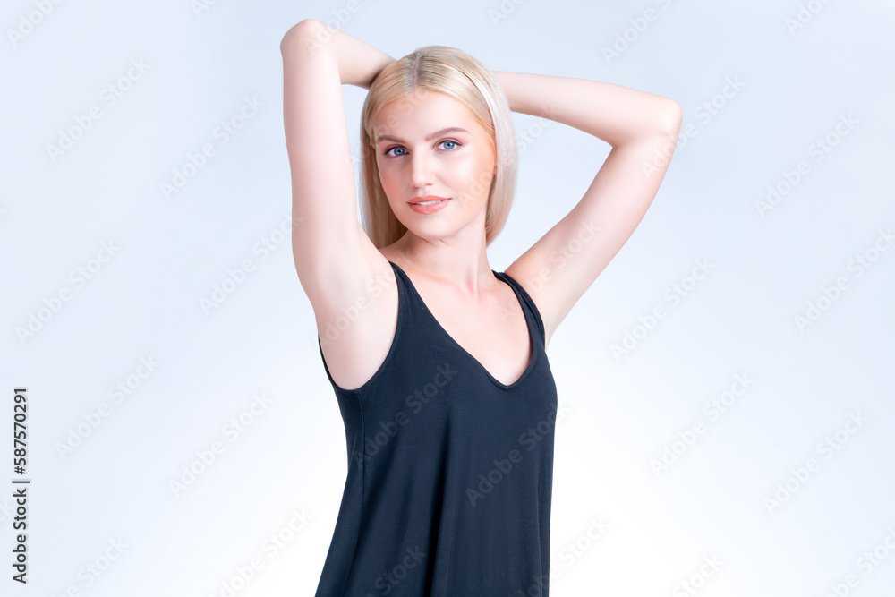Personable woman lifting her armpit showing hairless hygiene underarm ...