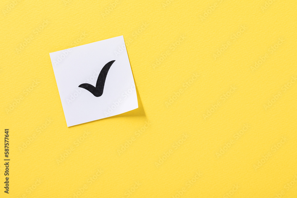 concept that expresses a checkmark using post-it Stock Photo | Adobe Stock