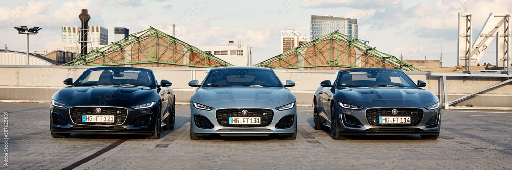Three Jaguars F type standing side by side in the parking lot. Front ...