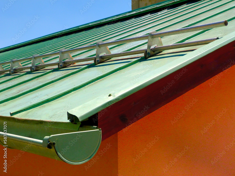 aged green weathered copper plate sloped roof. vertical seams. aluminum ...