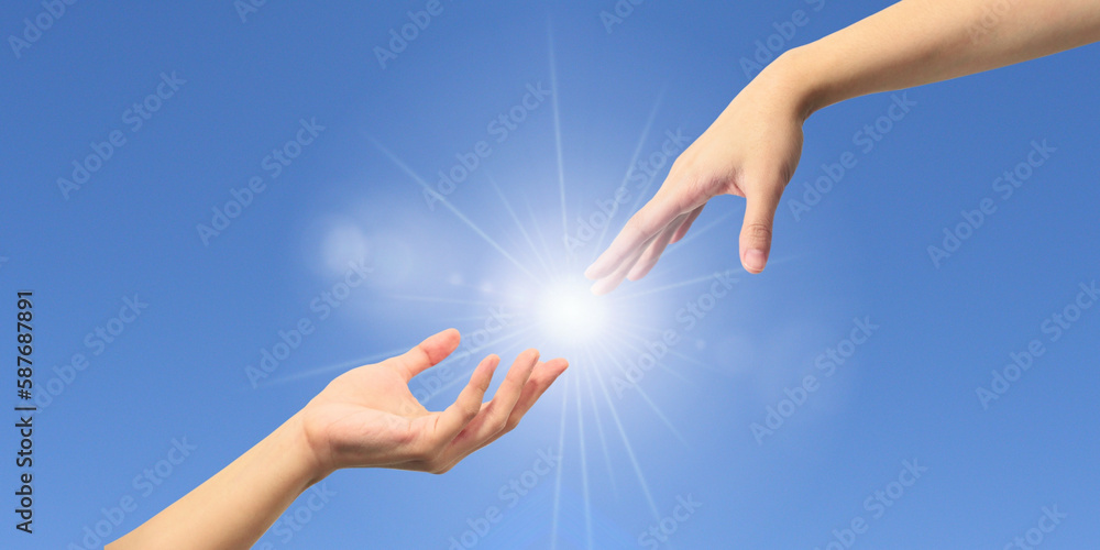 Helping hands emerging from a blue sky. God reaching out to praying ...