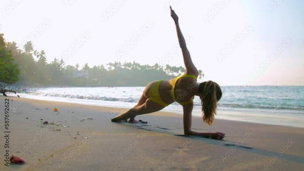 Video Stock Lady with long ponytail in bikini stands still in side ...