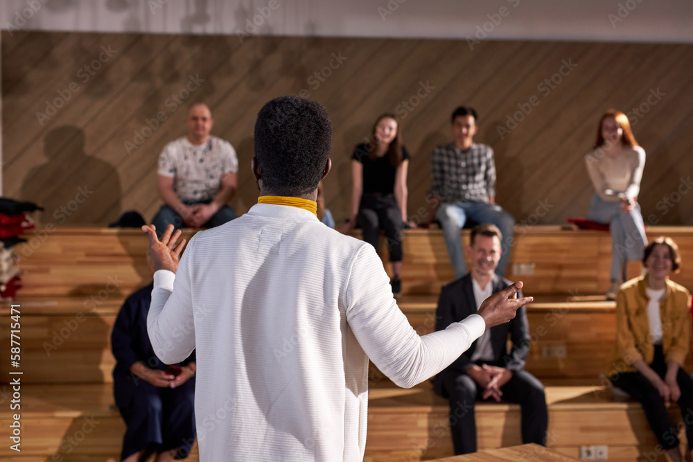 Rear View On Black Male Teacher Professor Holding Presentation Lecture ...