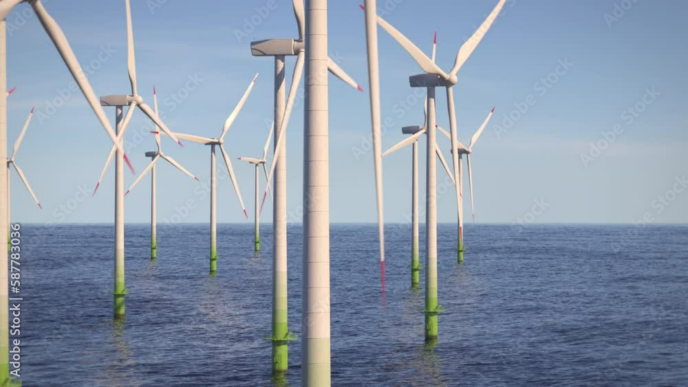 Aerial view of an offshore wind farm with several wind turbines in the ...