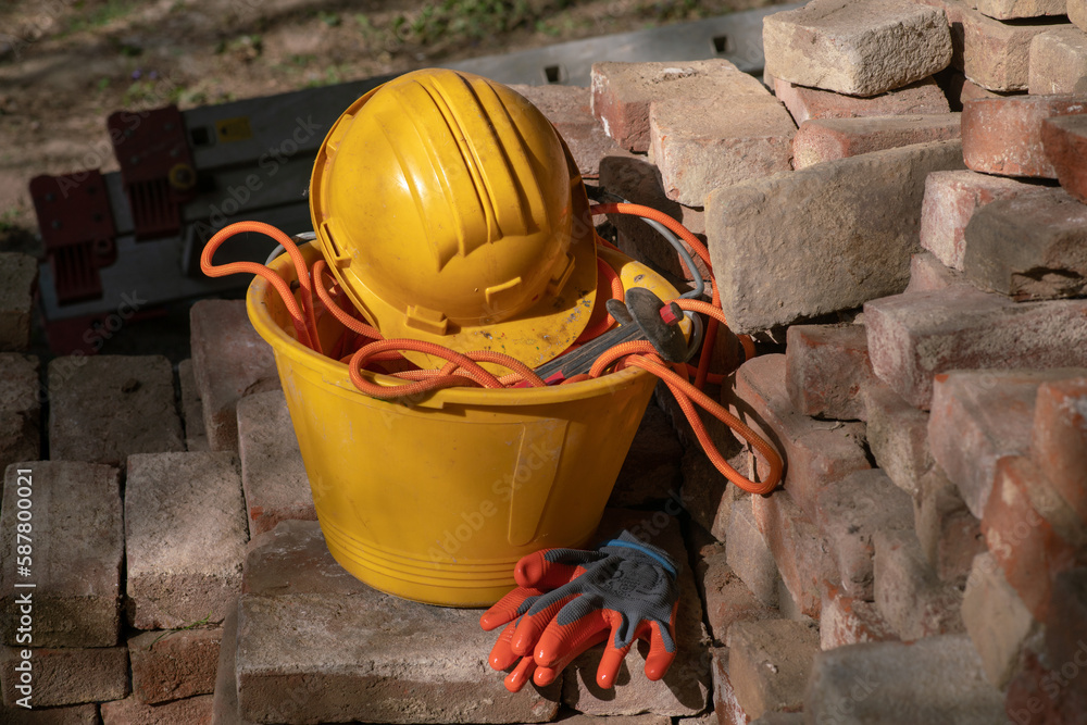 work on construction sites, individual protection of helmet, hammer and ...