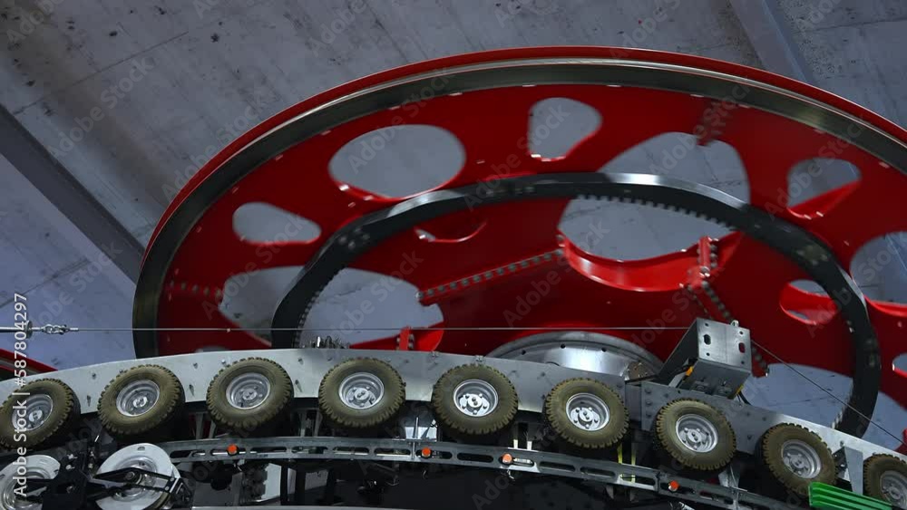 Close-up of wheels with steel cables, part of the cable car mechanism ...