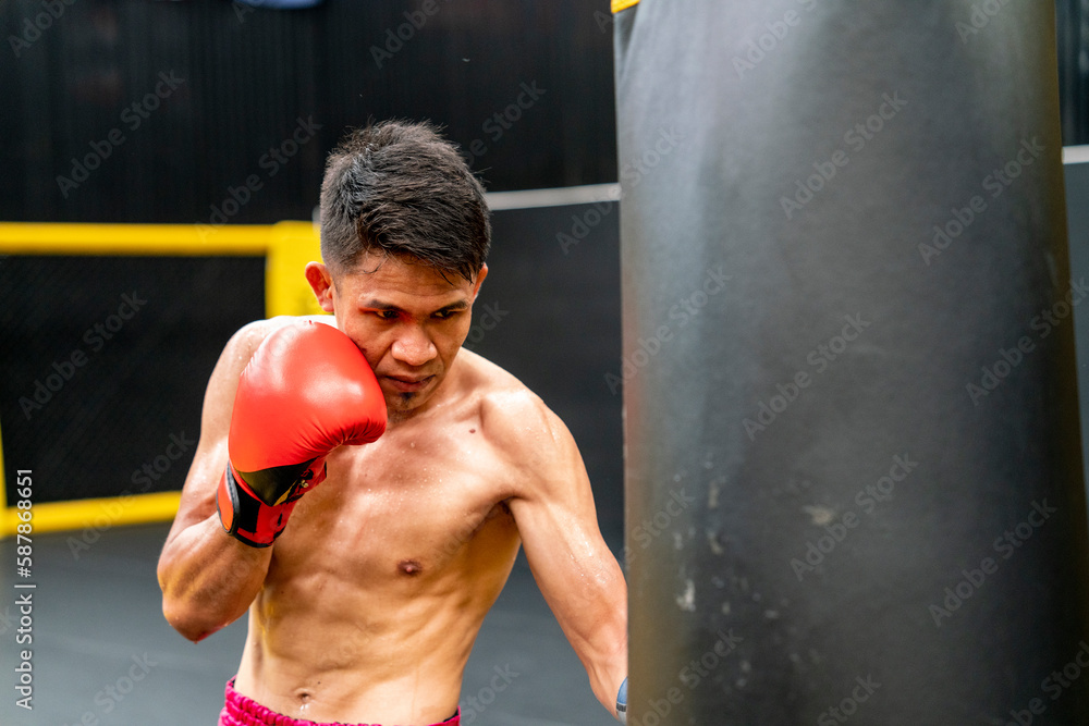Filipino male boxers wear boxing trunks and wrap their hands and arms ...