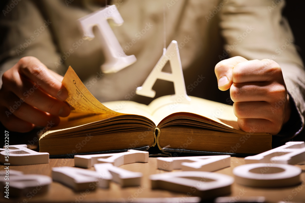 Man holding an open book with two hands. Concept of learning, education ...