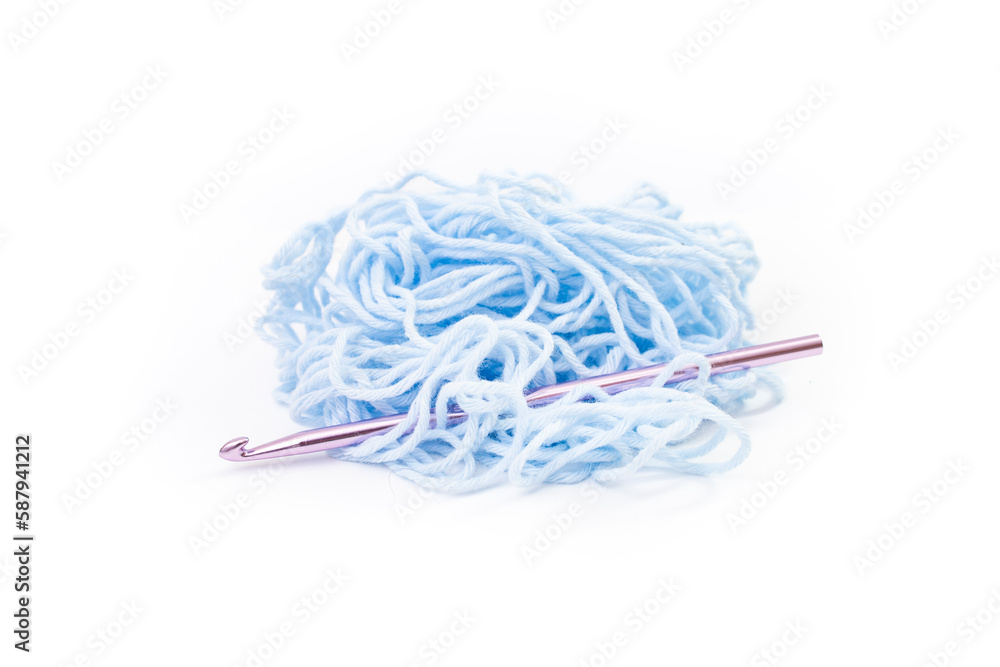 Bright blue tangled thread with a purple colored crochet hook Stock ...