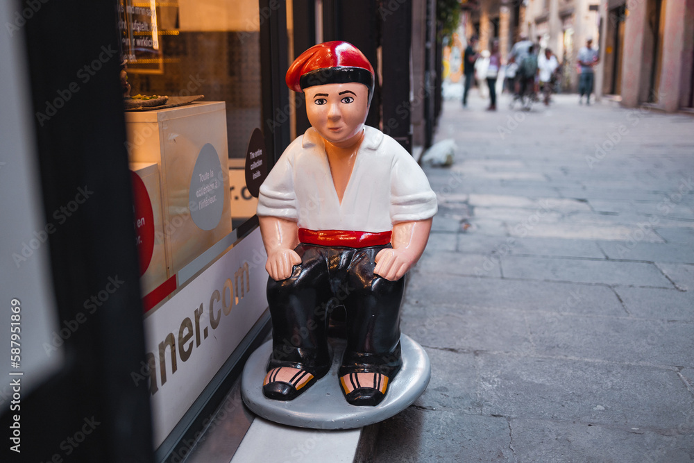 Caganer wearing traditional hat barretina, originally character in ...