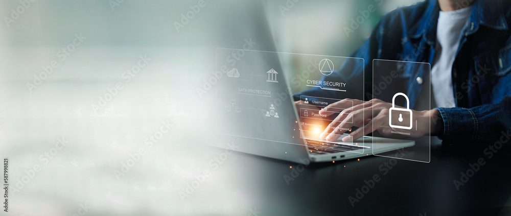 businesman is using laptop for cyber security protection , security login with key , user ...