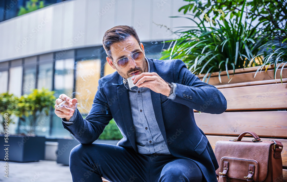 Business, stress and alcoholism. Fired depressed businessman drinking ...