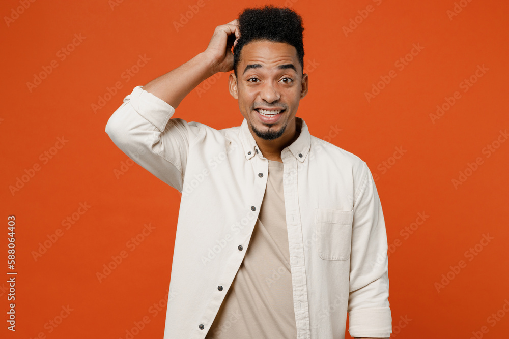 Young mistaken sad man of African American ethnicity wear light shirt ...