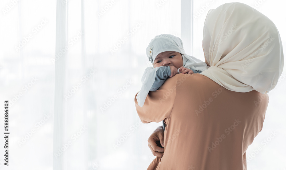 Muslim family, an Asian mother holding baby newborn girl is 2-month-old ...