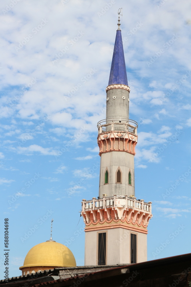 dome and Minaret of the masjid sign of Islam cloud blue sky background ...