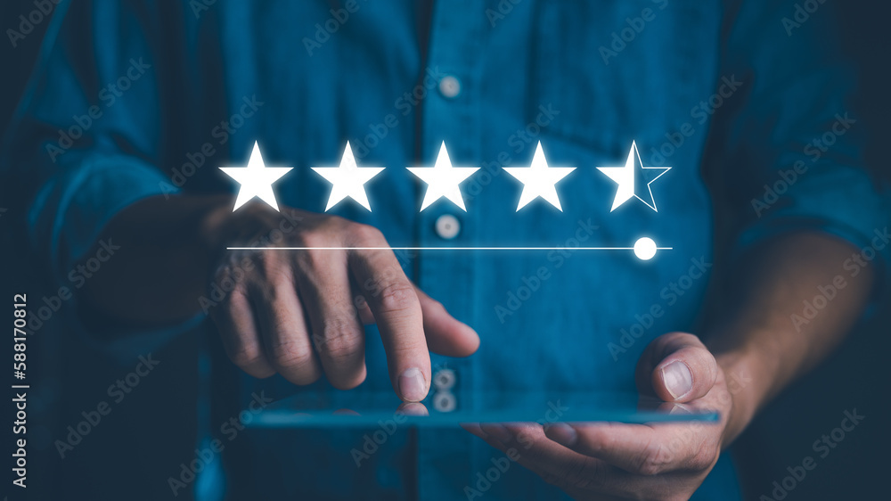 Businessman using mobile phone give five stars for excellent evaluate ...