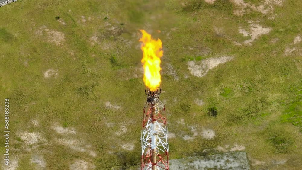 A fire on flare stack at refinery oil and gas central processing ...