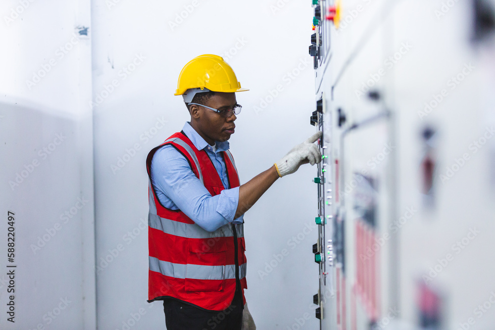 African American workers man ate work in electronic control room ...