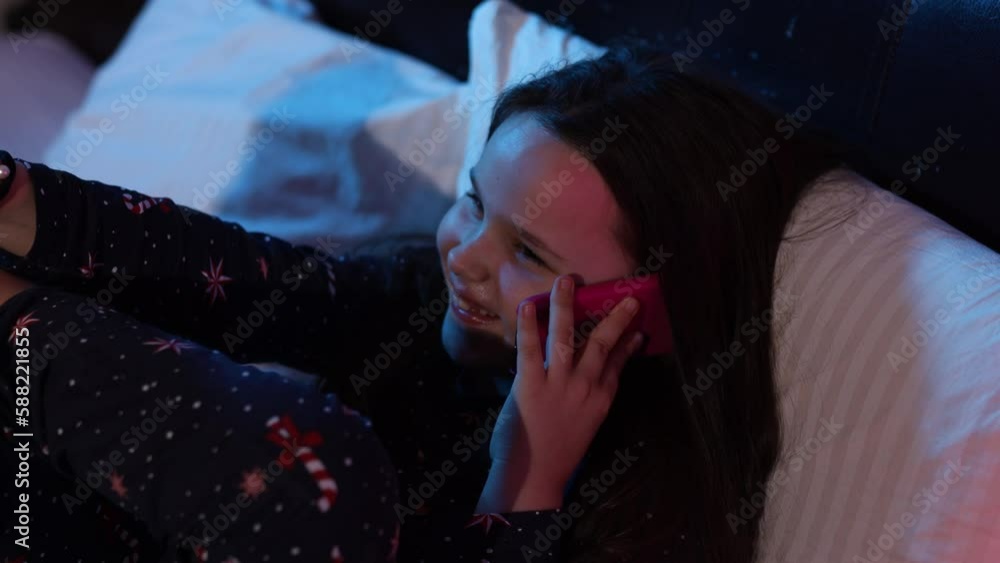 Portrait of happy preteen girl with loose dark hair wearing black ...