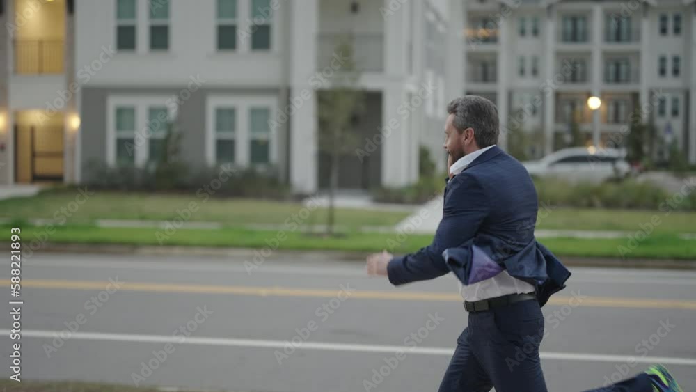 Slow motion business man run with phone outdoor. Running businessman ...