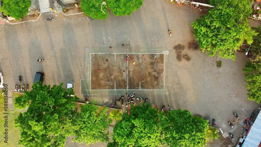 Beautiful aerial top down view of children playing Beach Volleyball on ...