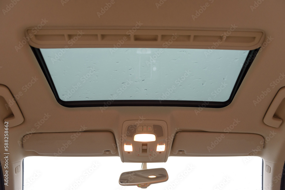 Buttons on the panel to open or close the hatch in the car. Сloseup of ...