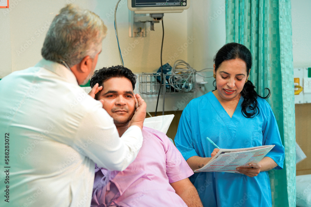 Senior Doctor check up to patient on bed at hospital. Stock Photo ...
