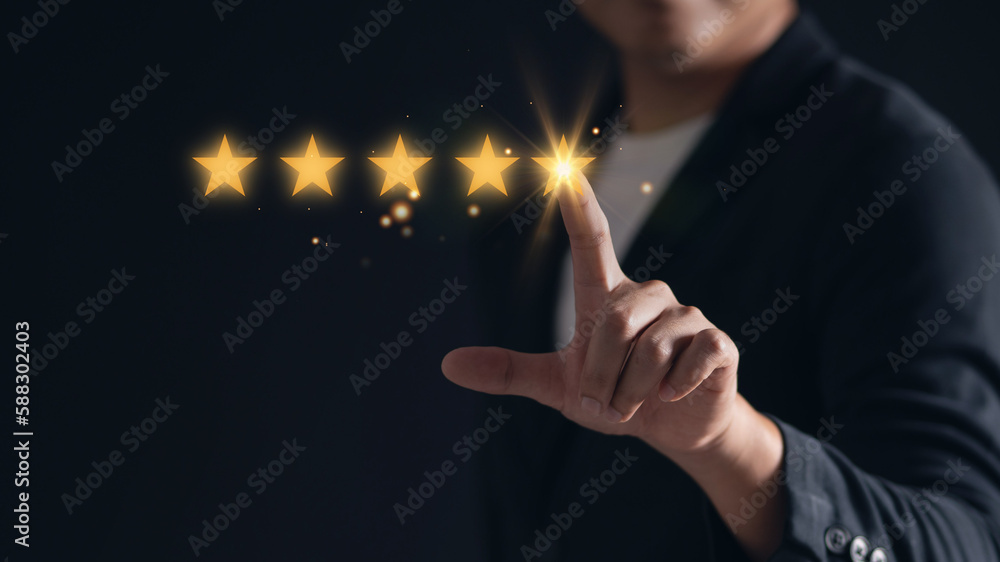 Man pointing to give a five-star rating, symbolizing customer ...