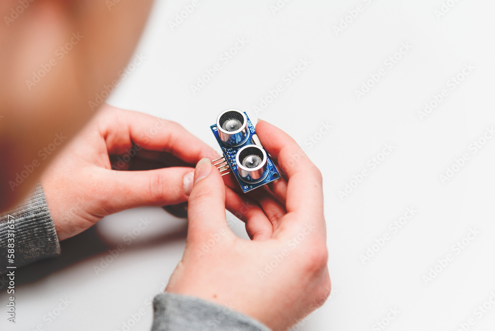 Student girl Learning To Program Robot Ultrasonic distance sensors ...