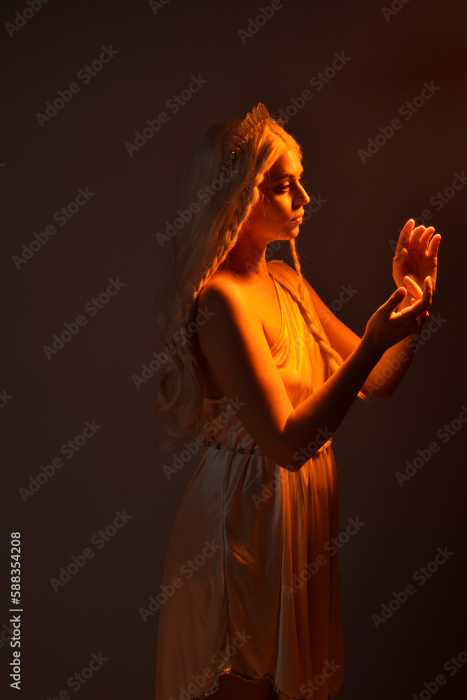 portrait of beautiful blonde woman wearing a fantasy goddess toga ...