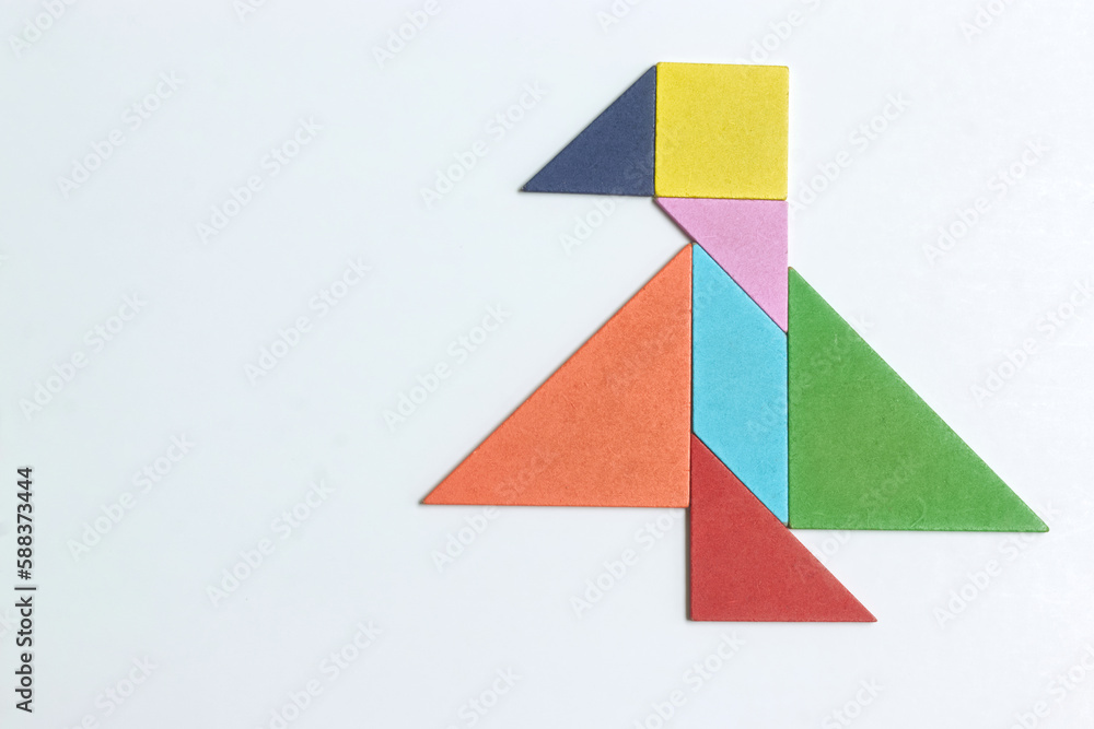 color tangram puzzle in flying bird shape on white background Stock ...