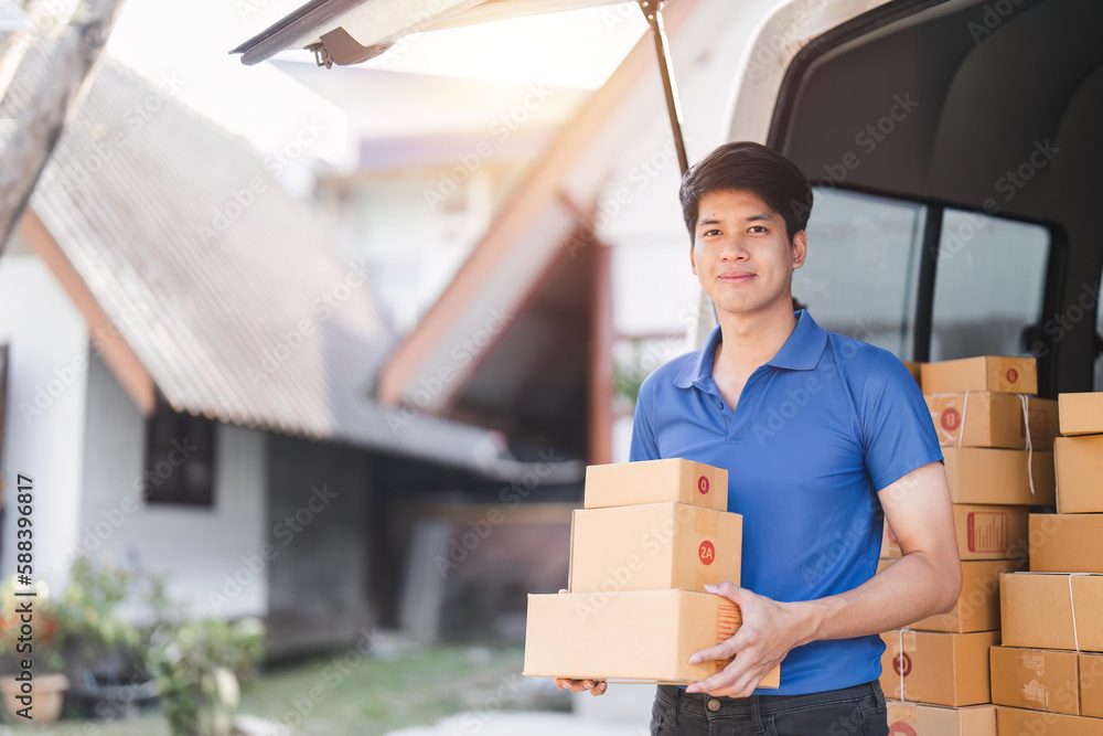 Smiling delivery asian man standing in front of his van. Portrait of ...