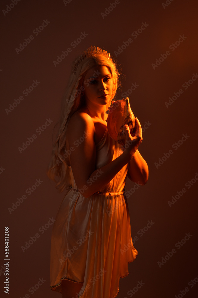 portrait of beautiful blonde woman wearing a fantasy goddess toga ...
