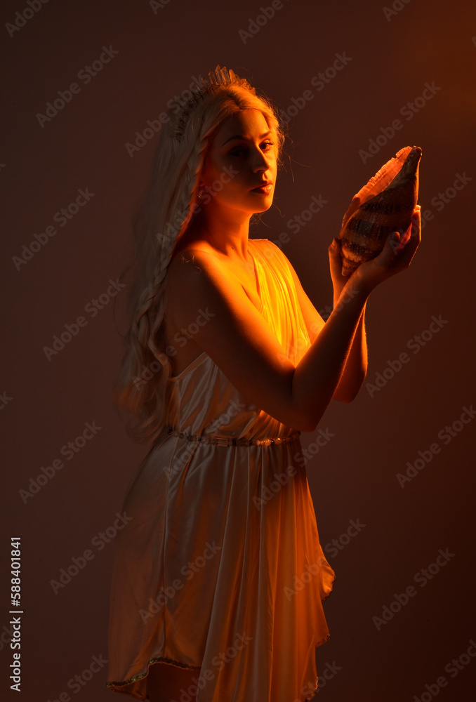 portrait of beautiful blonde woman wearing a fantasy goddess toga ...