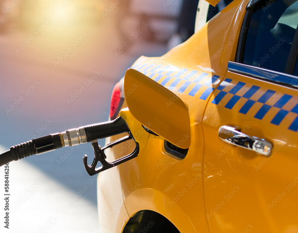 Refuel cars at the fuel pump. The driver hands, refuel and pump the car ...