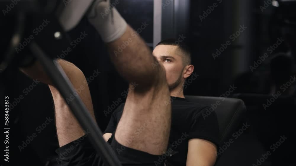 Gym equipment, Fit male athlete, Leg muscle. Attractive male athlete ...