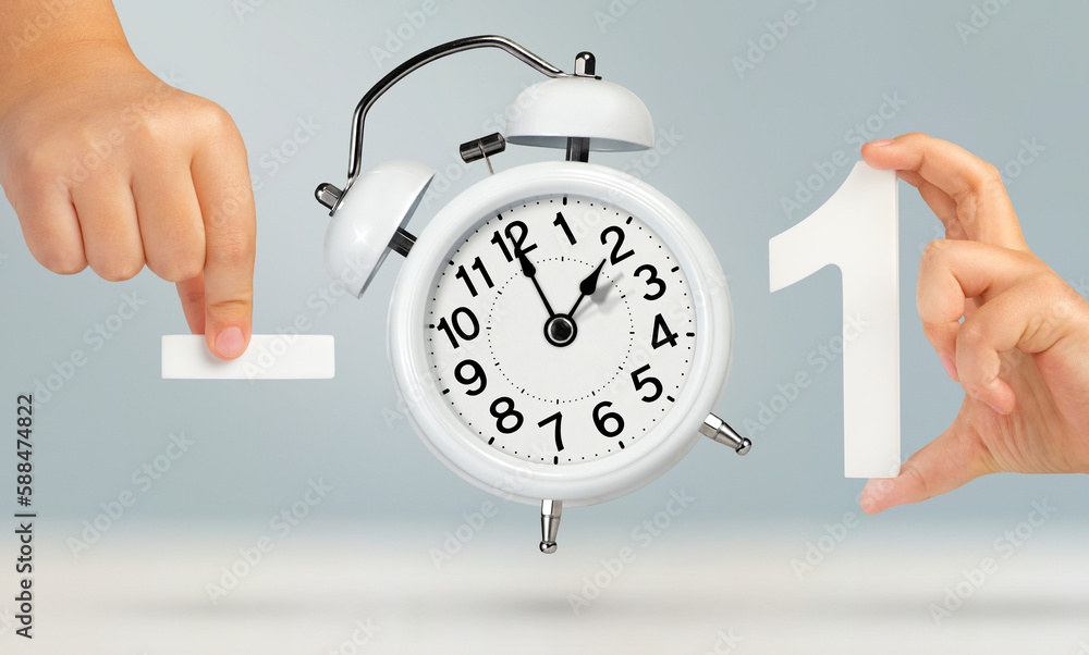 Change time, minus one hour. Fall back, on a gray background. A white ...