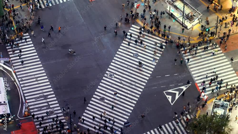 TOKYO - OCT 3rd, 2022: Aerial view of people and traffic crossing the ...
