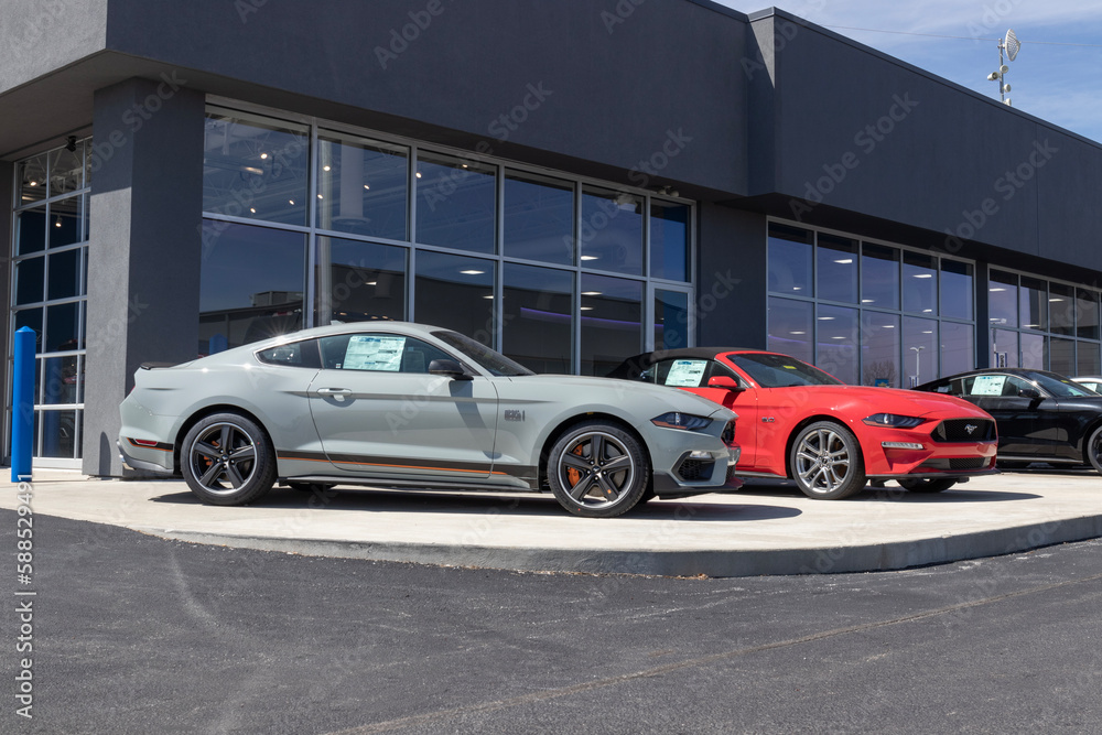 Ford Mustang display at a dealership. Ford offers the Mustang in a base ...