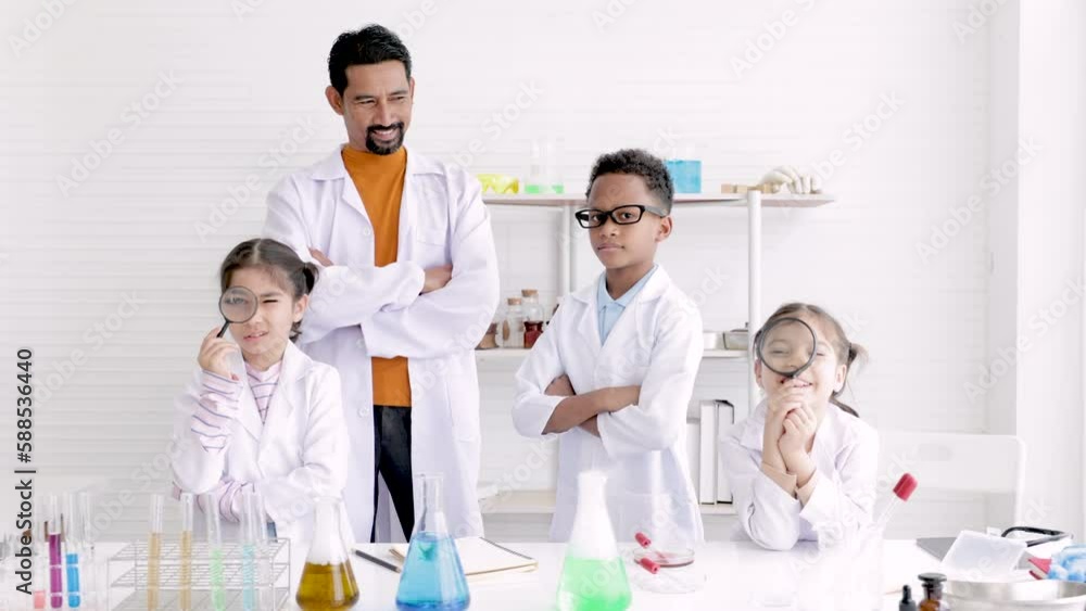 Sciense teacher and multiracial students standing with confidence in ...