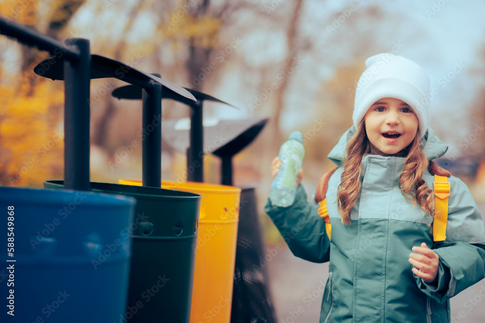 Little Girl Throwing a Plastic Bottle in the Recycle Bin. Responsible ...