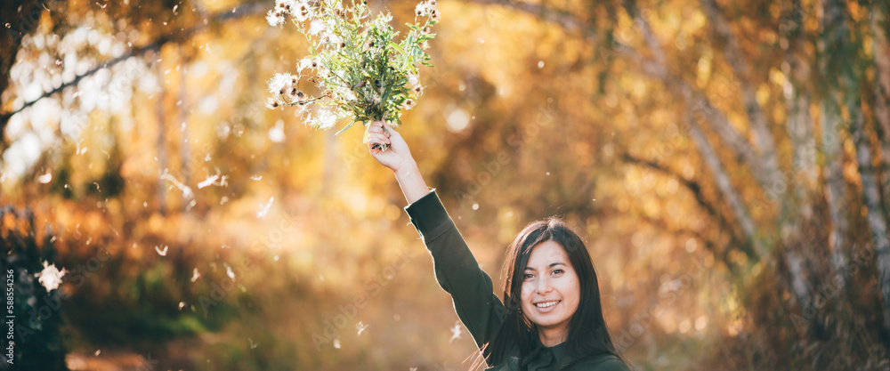 Dreamy beautiful girl with thistle flowers on bokeh background with ...