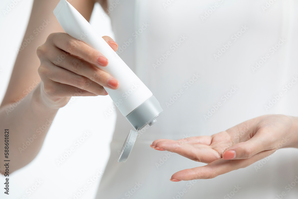 Beautiful young Chinese woman with face wash Stock Photo | Adobe Stock