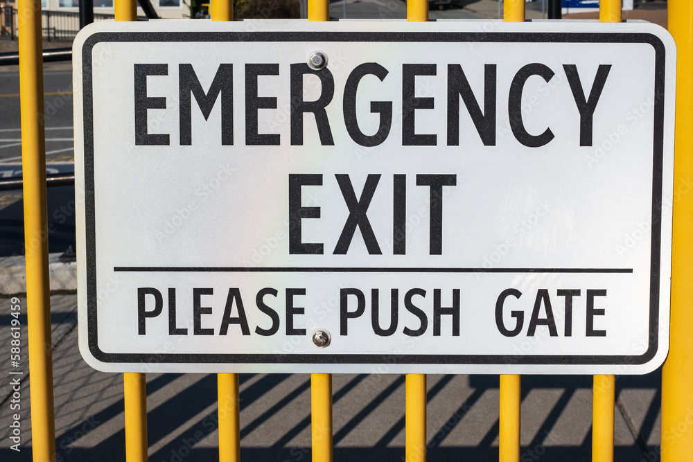 Emergency exit sign. Exterior, exit sign on a gate on a street Stock ...