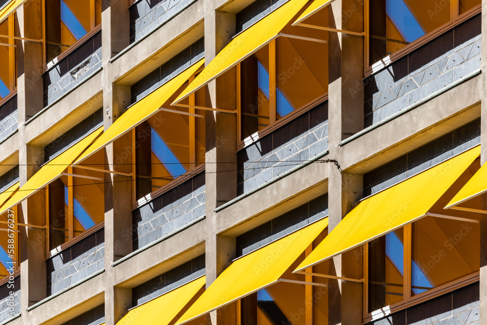 Foto de Copenhagen, Denmark A office building with yellow awnings over ...