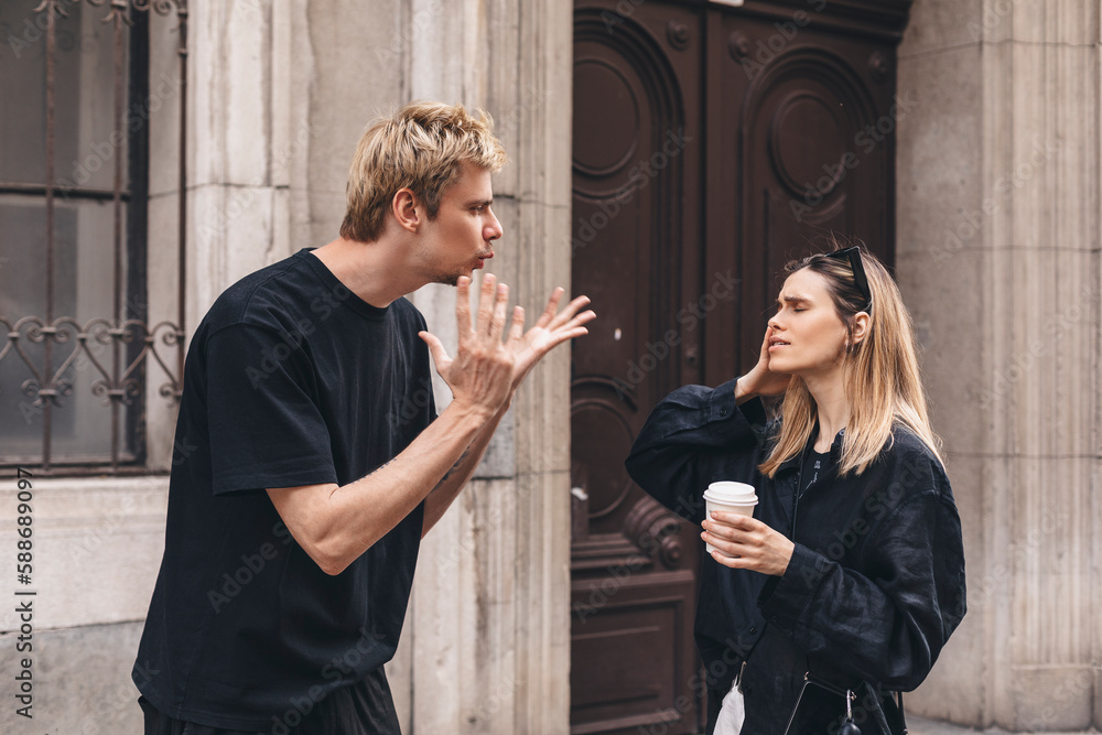 Young arguing sad couple two friends family man woman in casual clothes ...