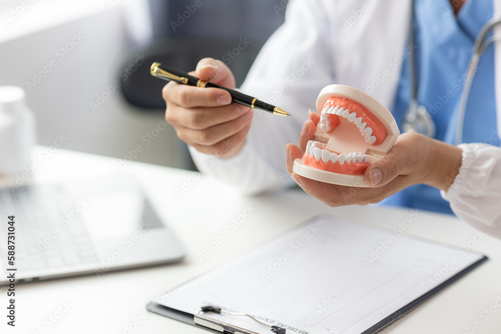Oral dentistry. Dentist in uniform writing patient information on ...