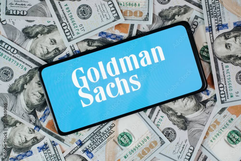 Goldman Sachs bank logo on screen of smartphone lying on money ...