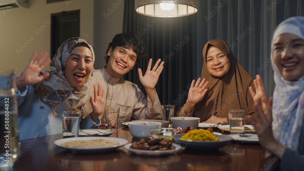 Happy Asian muslim family celebrate long distance with cousin looking ...