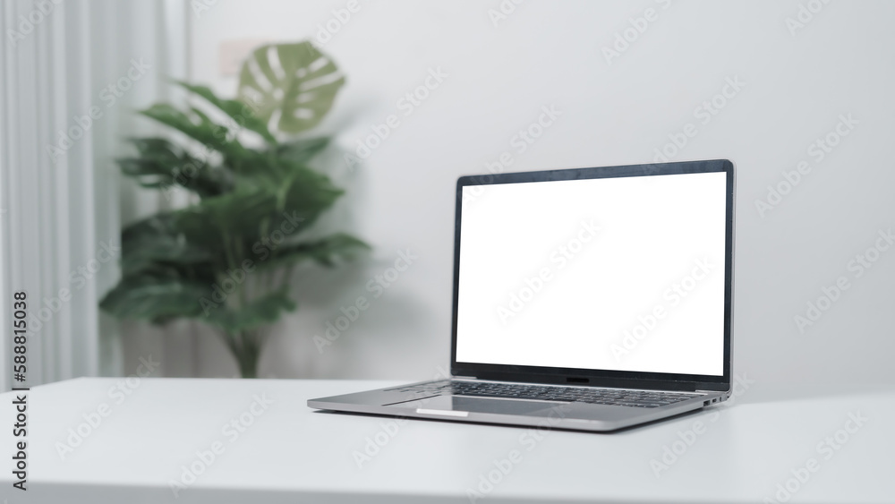 Blank screen of laptop pc computer on white desk table with monstera ...